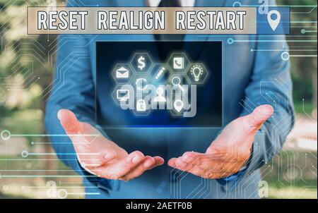 Writing note showing Reset Realign Restart. Business concept for Life ...