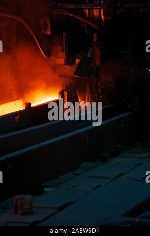 Pouring pig iron into the ironworks Stock Photo - Alamy