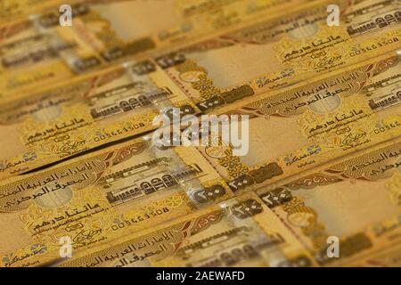UAE dirham currency notes close up. Money background blue color toned ...