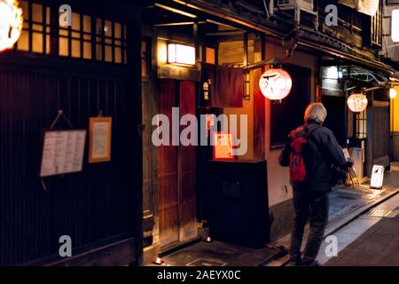 Japan in evening with illuminated hanging lantern lamp light on wooden ...