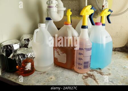 Variety in mysterious chemicals stored improperly and unlabeled in jugs ...