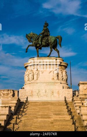 A Roman sculpture on Victor Emmanuel II Bridge with a dramatic sky in ...