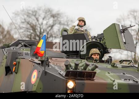Bucharest, Romania - December 01, 2019: French female soldier attaches ...