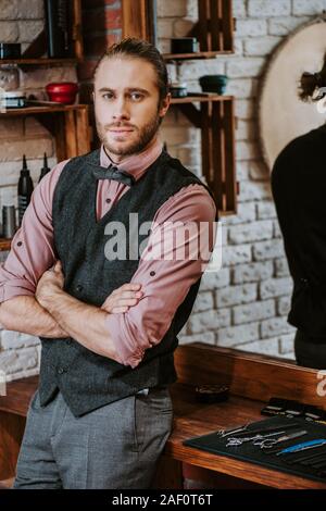 Man standing with arms crossed near his car Stock Photo - Alamy