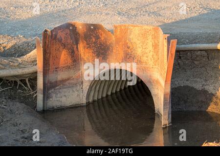 old rusty drainage ditch culvert Stock Photo - Alamy