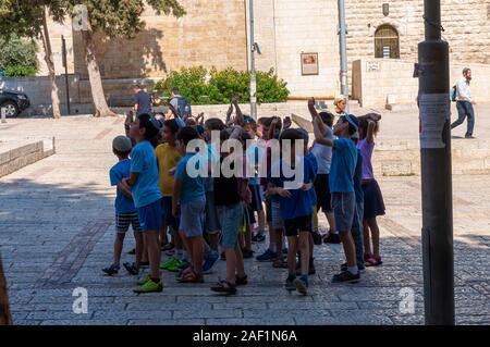 Jewish children playing on the streets of the old city in the Jewish ...
