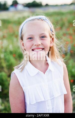 Portrait of flower girl, smiling Stock Photo - Alamy