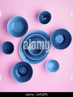 dinnerware, plates bowls on lilac table, top view, flat lay Stock Photo ...