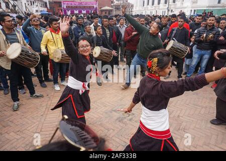 Women from newar community dressed in traditional attires look on while ...