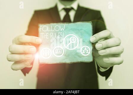 Writing note showing Follow The Rules. Business concept for go with ...
