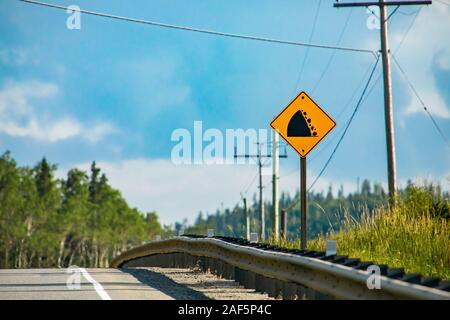 Watch for fallen rock and be prepared to avoid a collision sign ...