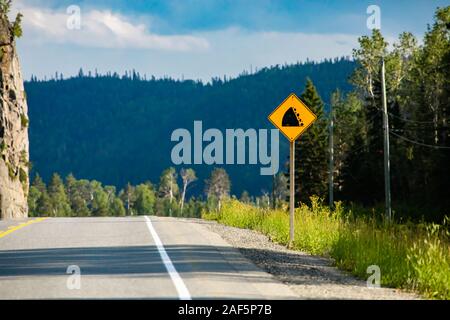 Watch for fallen rock and be prepared to avoid a collision sign ...