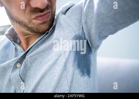 Mature Man Notices His Sweat Under Armpit Stock Photo - Alamy