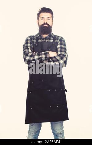 Skilled and confident. Grill master keeping his hand crossed with ...