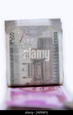 A concept of rupee bank notes folded into the shape of a mass of simple ...