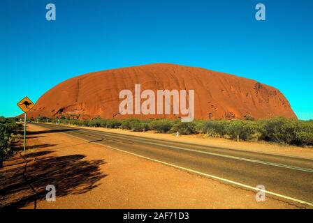 road sign by Ayers Rock (Uluru), Northern Territories, Australia Stock ...