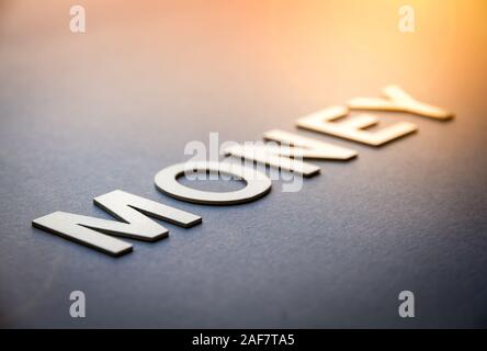 Word money written with white solid letters Stock Photo - Alamy