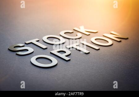 Word stock option written with white solid letters on a board. Word ...
