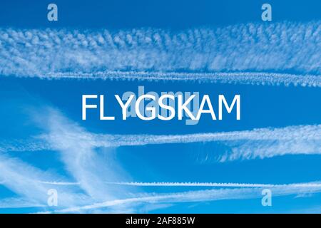 Climate change and flygskam concept image with blue sky and vapour ...