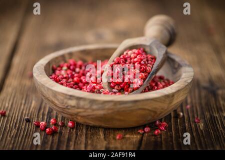 Pink Peppercorns on a vintage background as detailed close-up shot ...