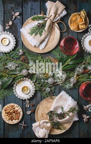 Christmas table setting with empty ceramic plates, traditional ...