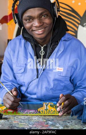 Artist painting in "Tinga Tinga" Style in Stone Town Zanzibar Tanzania ...