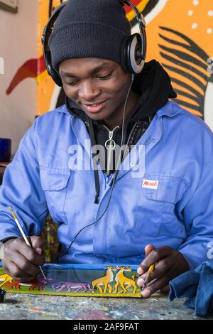 Artist painting in "Tinga Tinga" Style in Stone Town Zanzibar Tanzania ...
