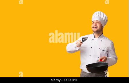 Chef Guy Holding Pan Throwing Invisible Food Standing, Studio Shot ...