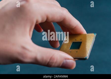 Hand holding CPU. Coonsumer 7 nanometer desktop CPU, processoor ...