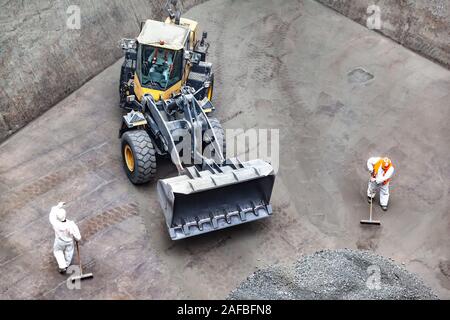 clinker unloading from a vessel container Stock Photo - Alamy
