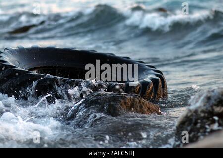 Tyre floating in the sea Stock Photo - Alamy