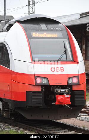 Cityjet train of Austrian Federal Railways on the rail tracks on sunny ...