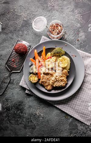 Cod steak baked with potato Stock Photo - Alamy
