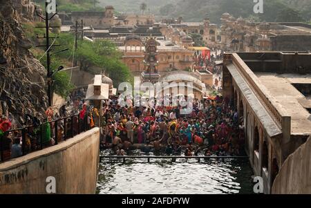 Hindu pilgrims bathing in the sacred waters of the Ram Kund. Godavari ...