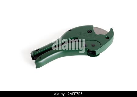 Green pipe cutter for plastic pipes. Close-up. Isolated over white ...