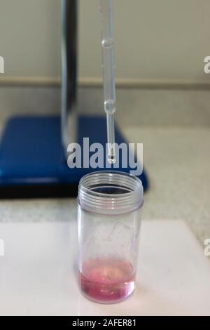 using a pipette while mixing chemical liquids Stock Photo - Alamy