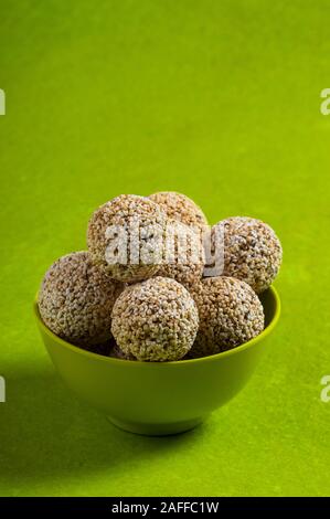 Amaranth or Rajgira laddu, Cholai ke laddo in green plate on green ...