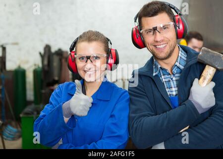 Production happy workers in coverall with different finished PVC ...