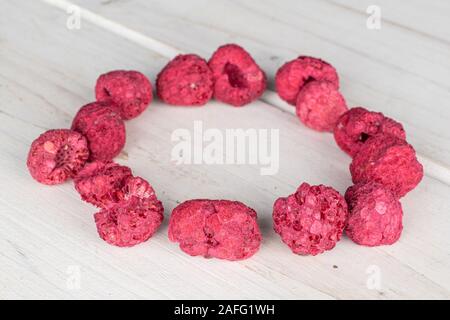 Lot of whole dried raspberry circle isolated on white background Stock ...