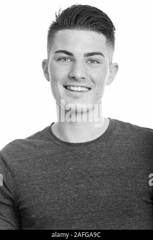 Portrait of a handsome latin man smiling, isolated over a white ...