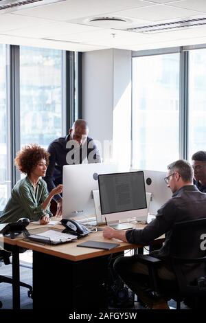 Young professionals using computers Stock Photo - Alamy