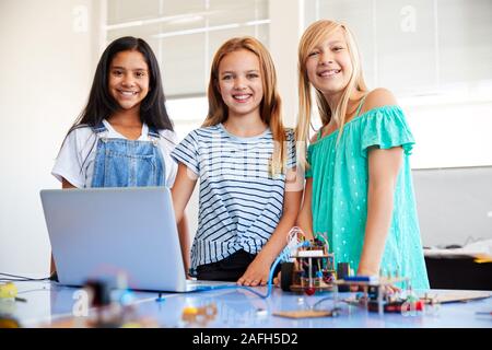 Three Female Students Building And Programing Robot Vehicle In After ...