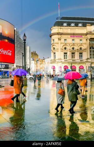 Rainy wet day with rainbow, Piccadilly Circus, London, England, UK ...