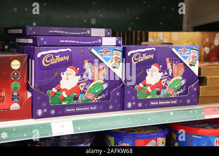 Boxes of chocolates on Sainsbury`s supermarket shelves at Christmas ...