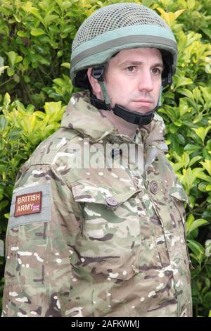 British Army Soldier in army greens camo outfit, jacket, and helmet ...