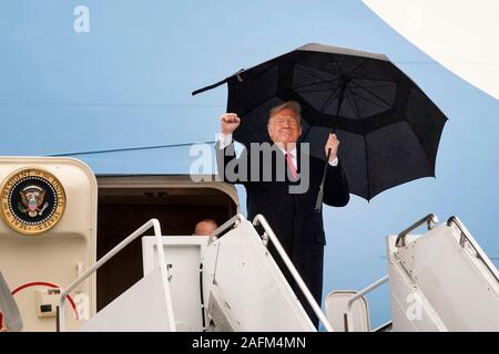 President Donald Trump pumps his fist alongside first lady Melania ...