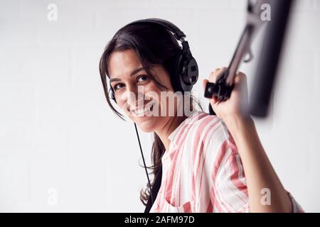 Portrait Of Female Sound Recordist Holding Microphone On Video Film ...