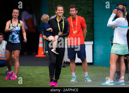 Victoria Azarenka of Belarus warms up for her doubles match with son ...