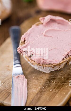 German Leberwurst on an old wooden table as detailed close-up shot ...