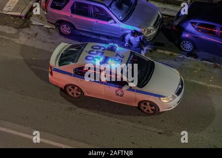 Elevated view of Greek police car with alarm lights on blocking the ...